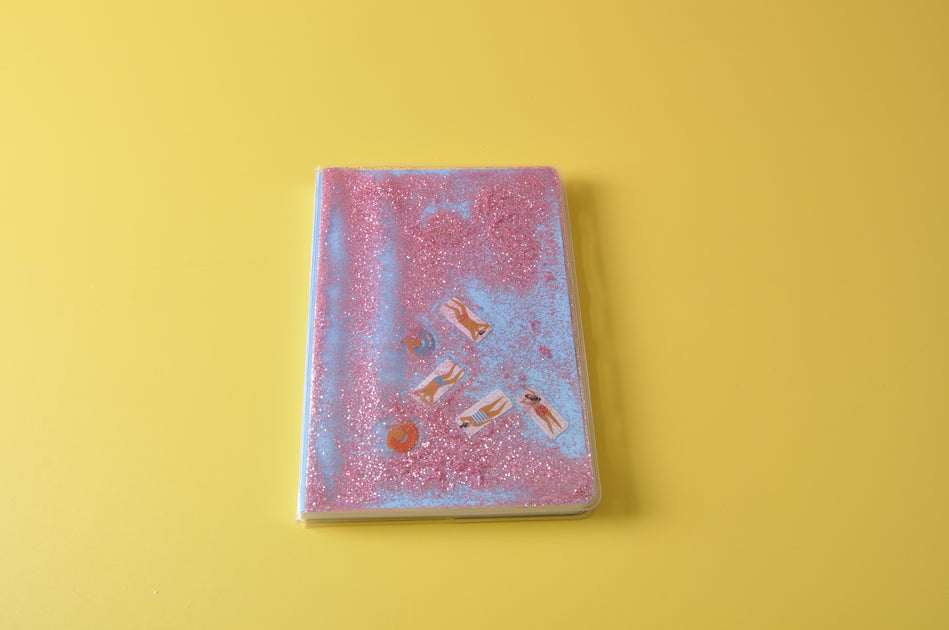 FLOATING SWIMMERS LIQUID GLITTER NOTEBOOK – HIGHER